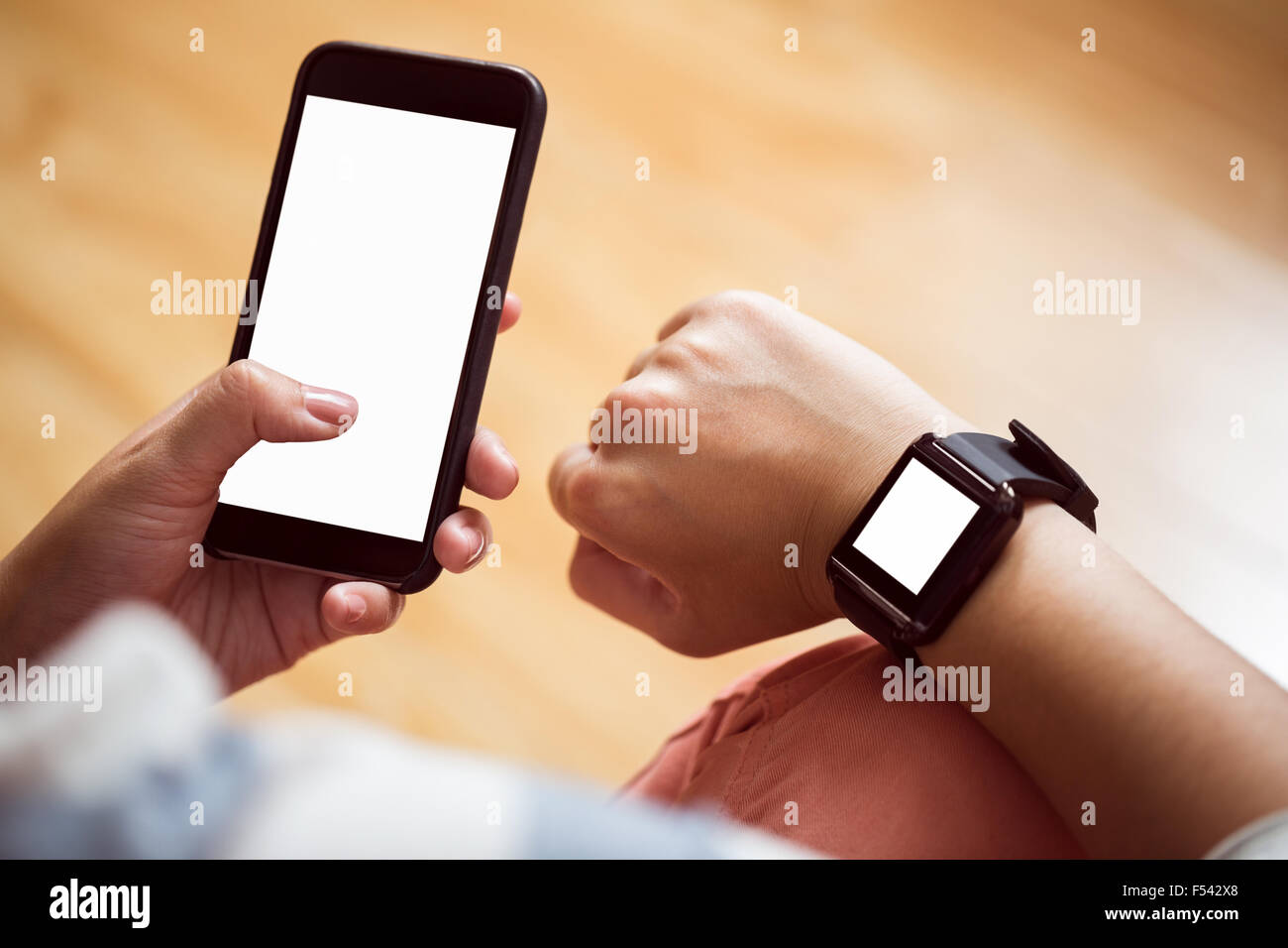 Asian woman using smart watch and phone Stock Photo - Alamy