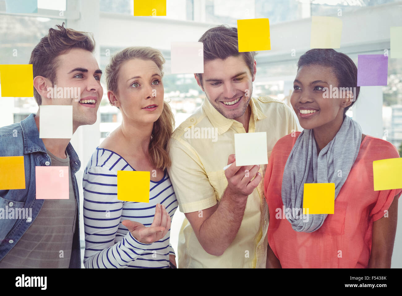 Creative team using post it notes Stock Photo - Alamy