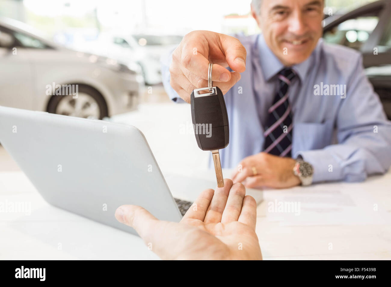 Smiling salesman holding customer hi-res stock photography and images ...