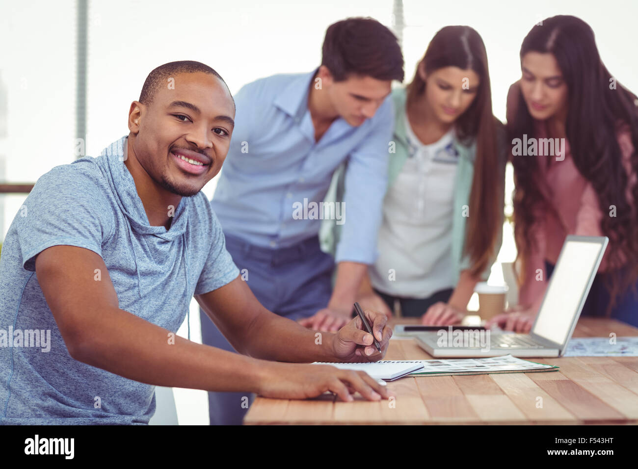 Young creative team working together Stock Photo - Alamy