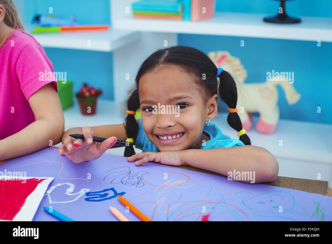 Children drawing on coloured paper Stock Photo - Alamy