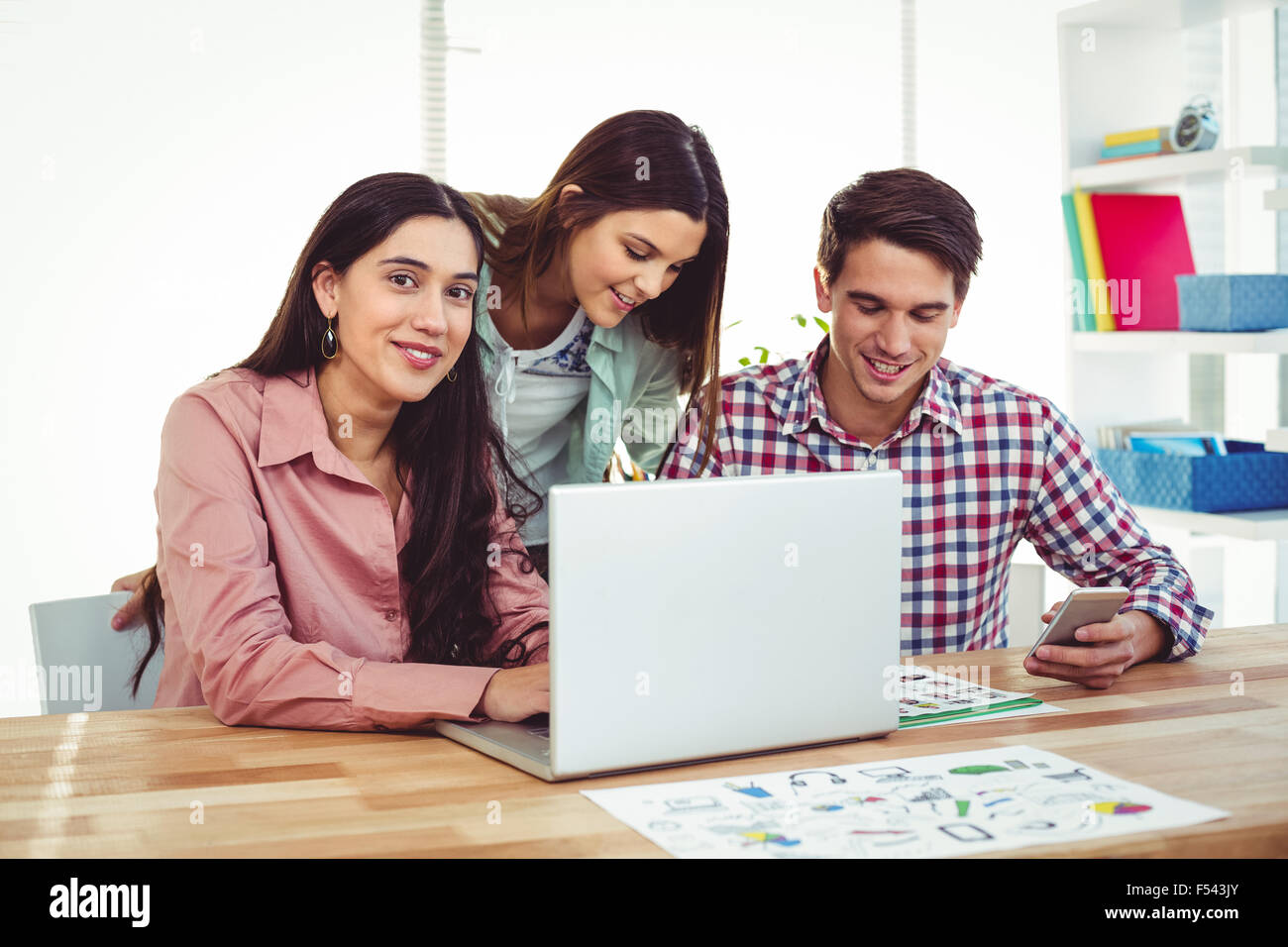 Young creative team working together Stock Photo - Alamy