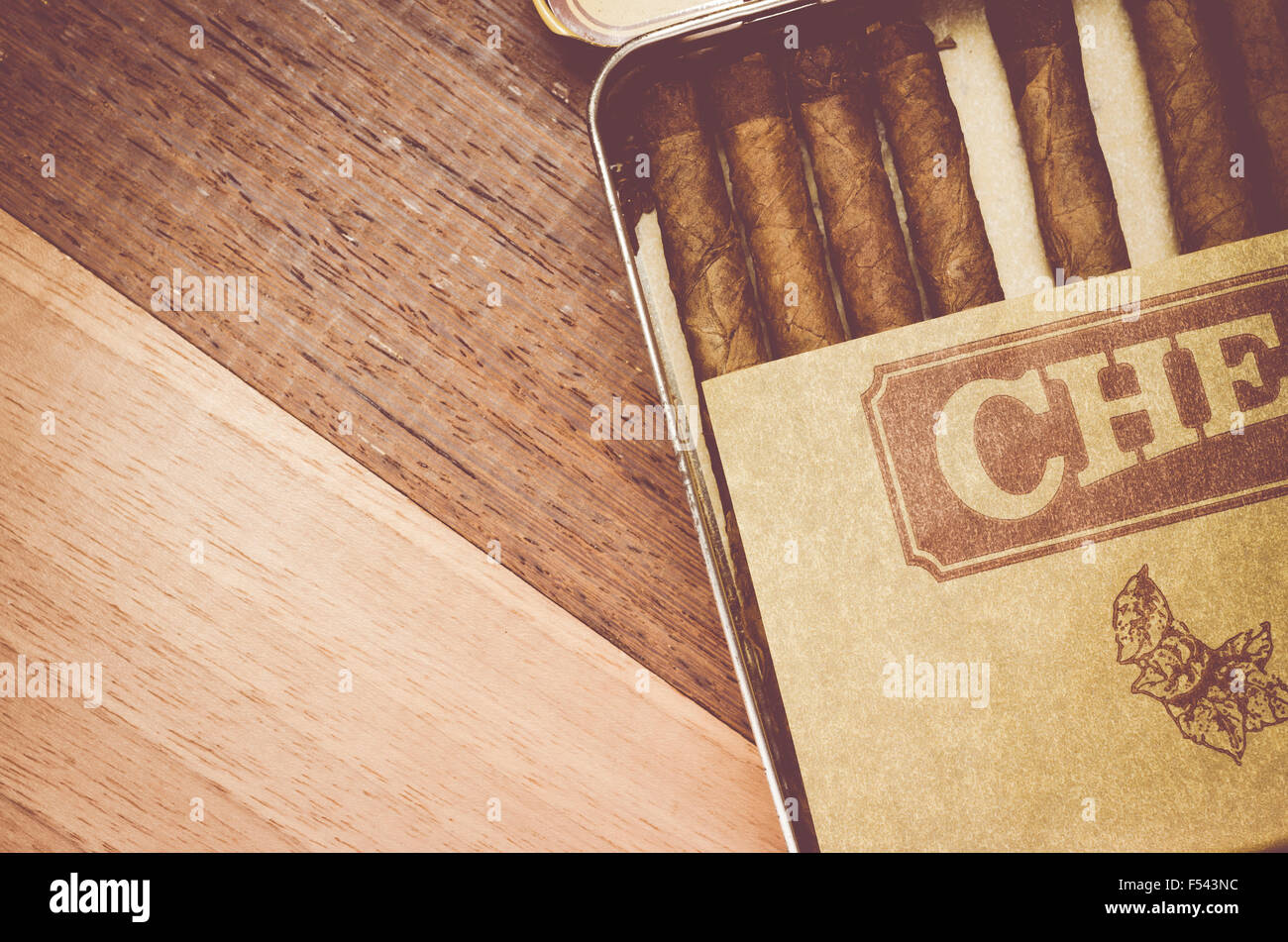 metal box of cuban cigars on a natural wood surface Stock Photo - Alamy