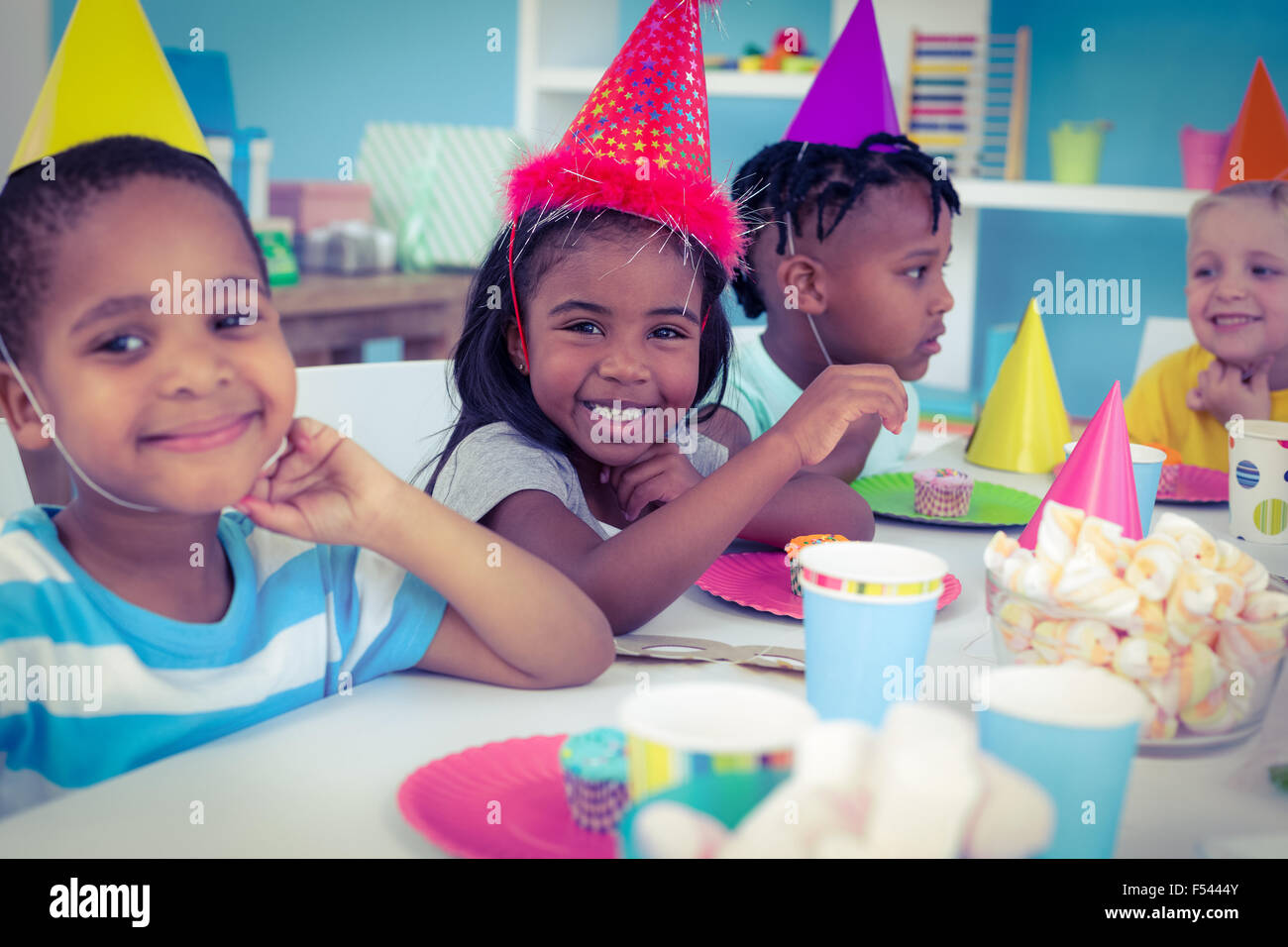 Excited kids enjoying a birthday party Stock Photo - Alamy