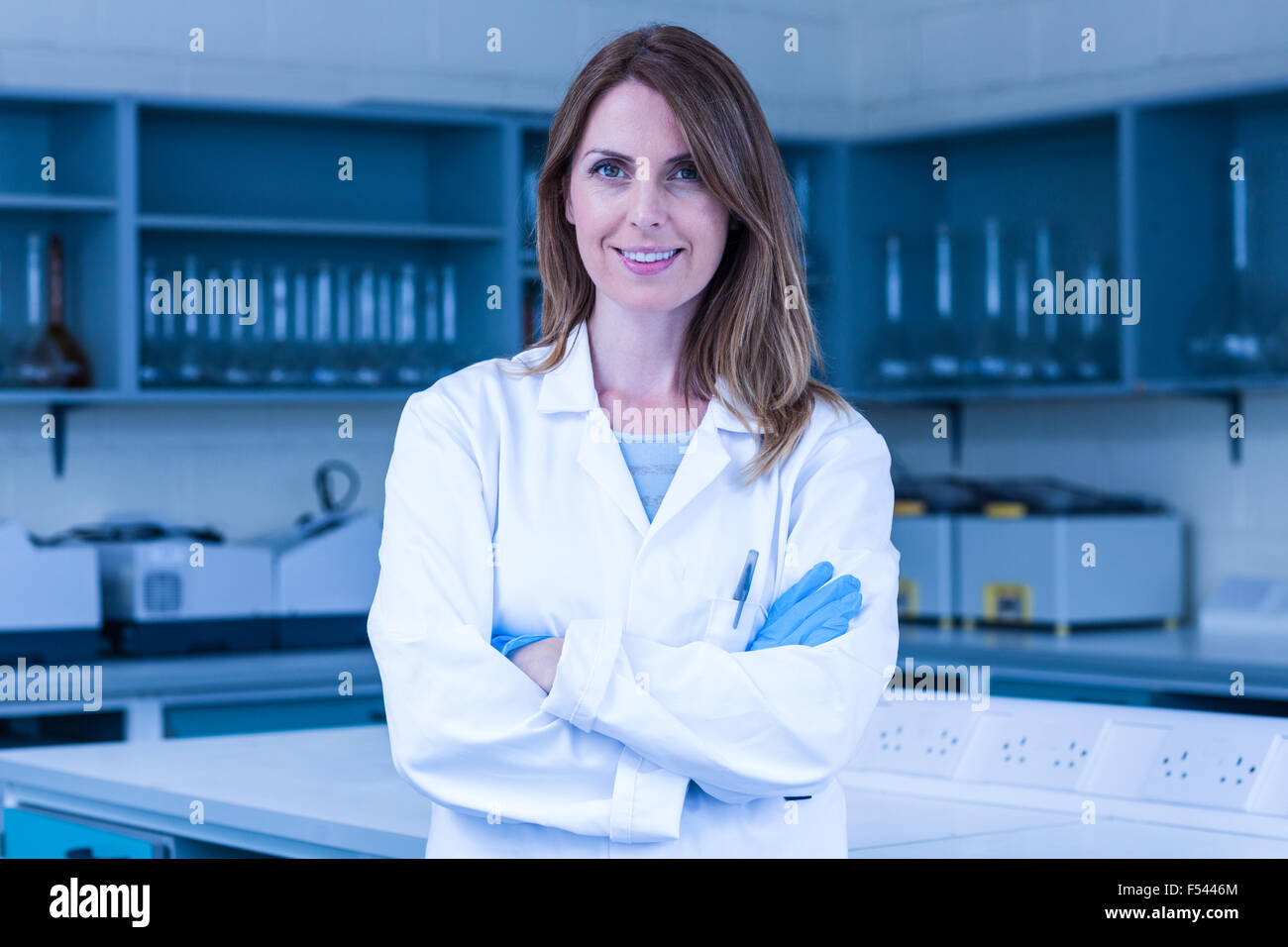 Scientist smiling at the camera in lab Stock Photo - Alamy