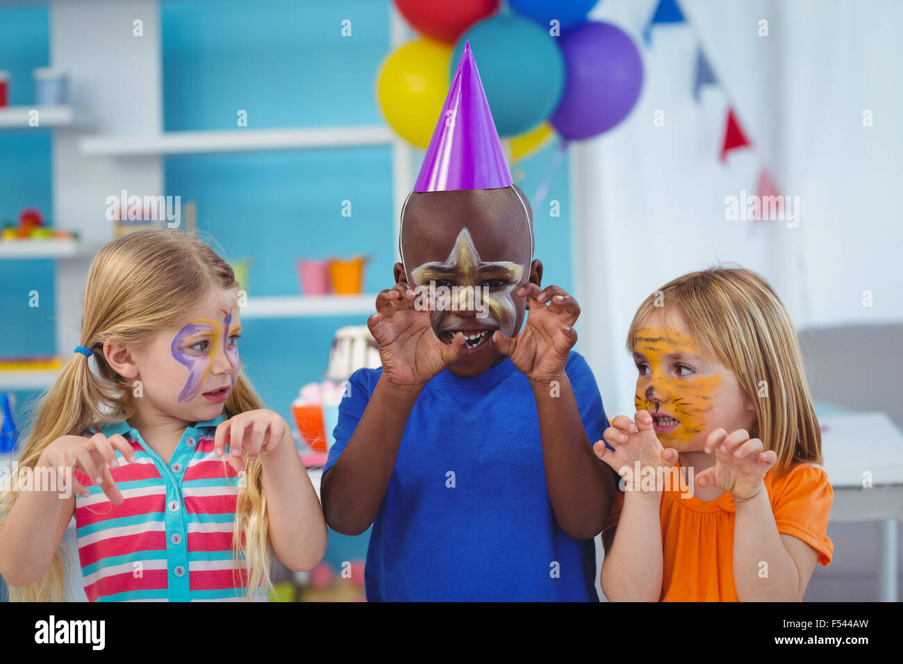 Kids faces hi-res stock photography and images - Alamy