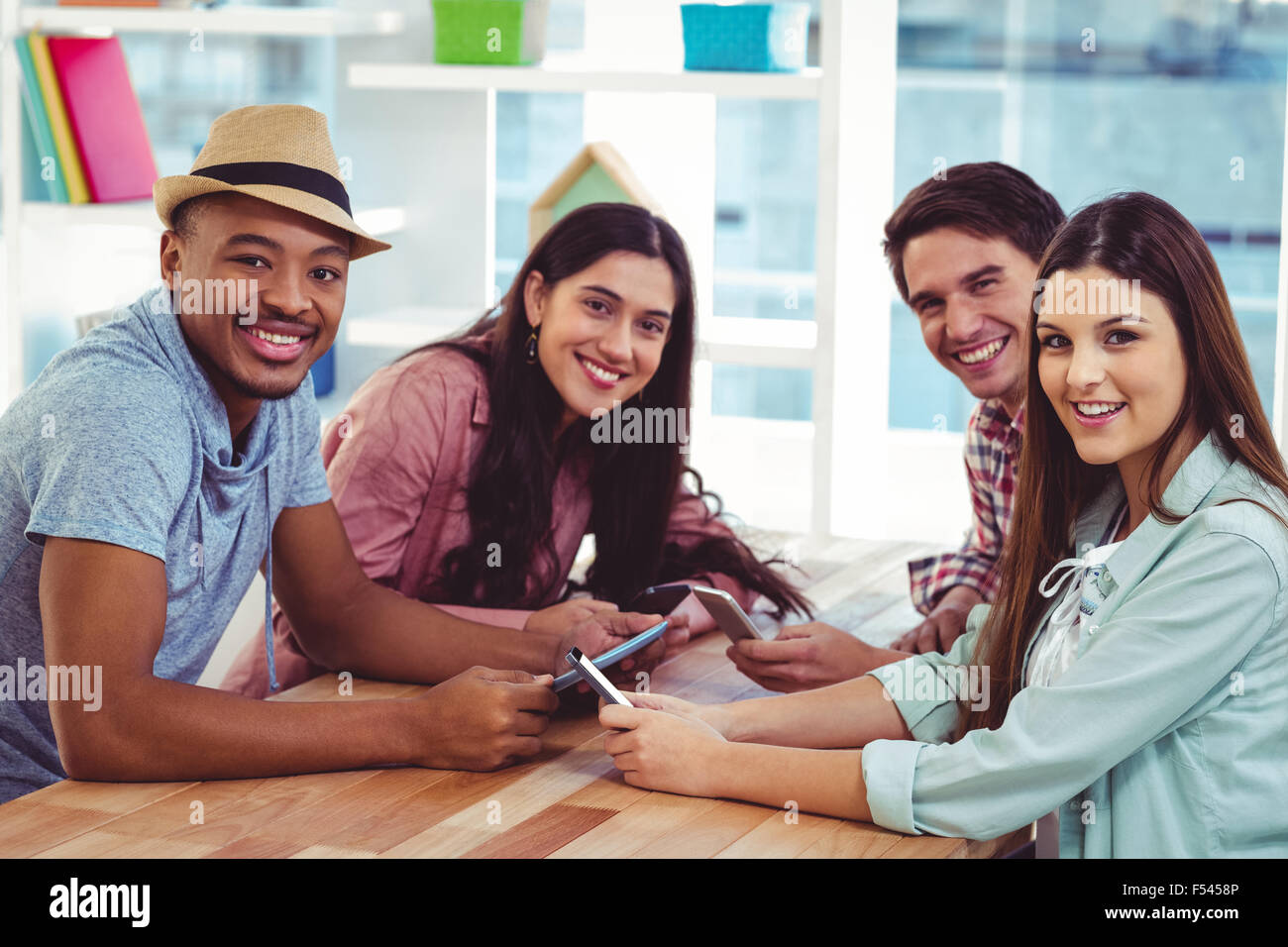 Creative business team using phones hi-res stock photography and images ...