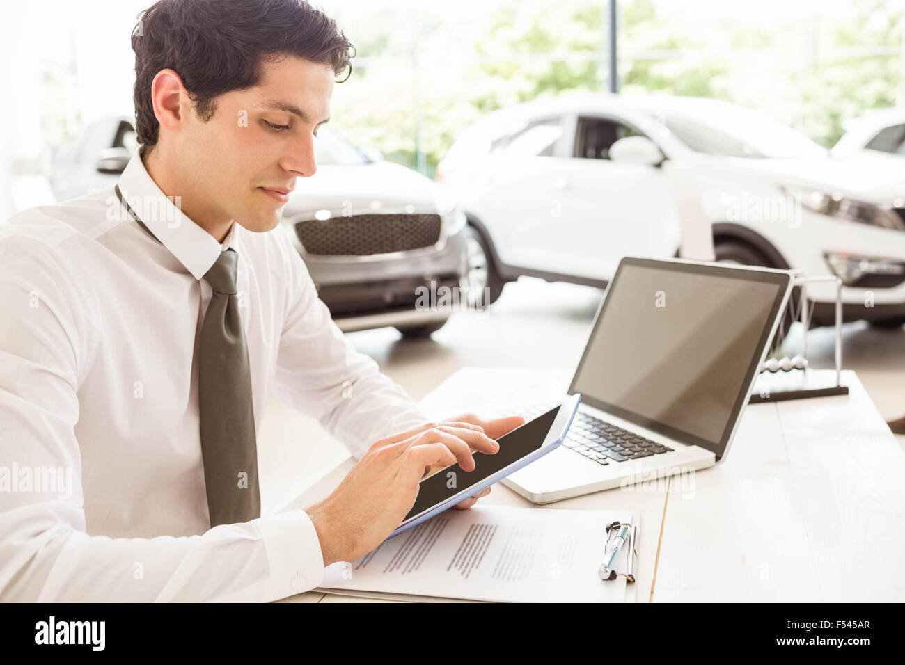 Handsome young salesman using hi-res stock photography and images - Alamy