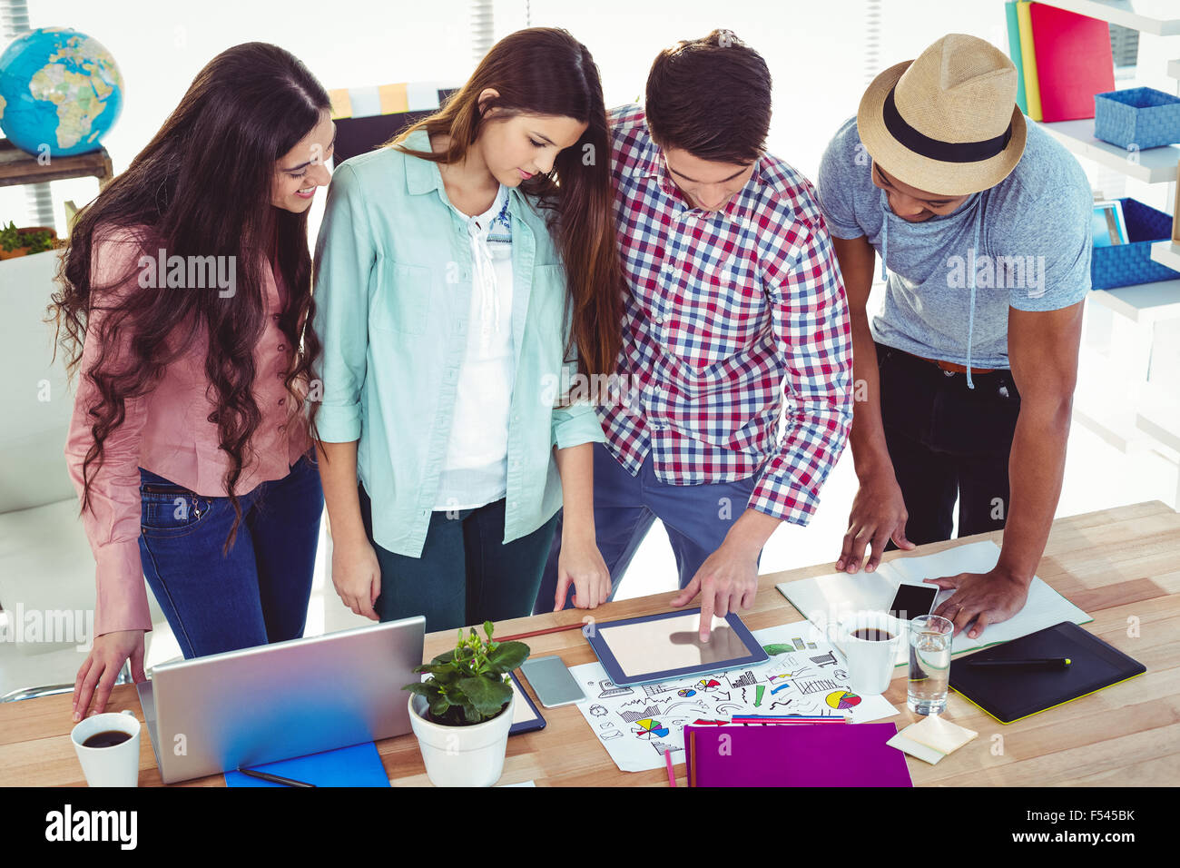 Young creative team working together Stock Photo - Alamy