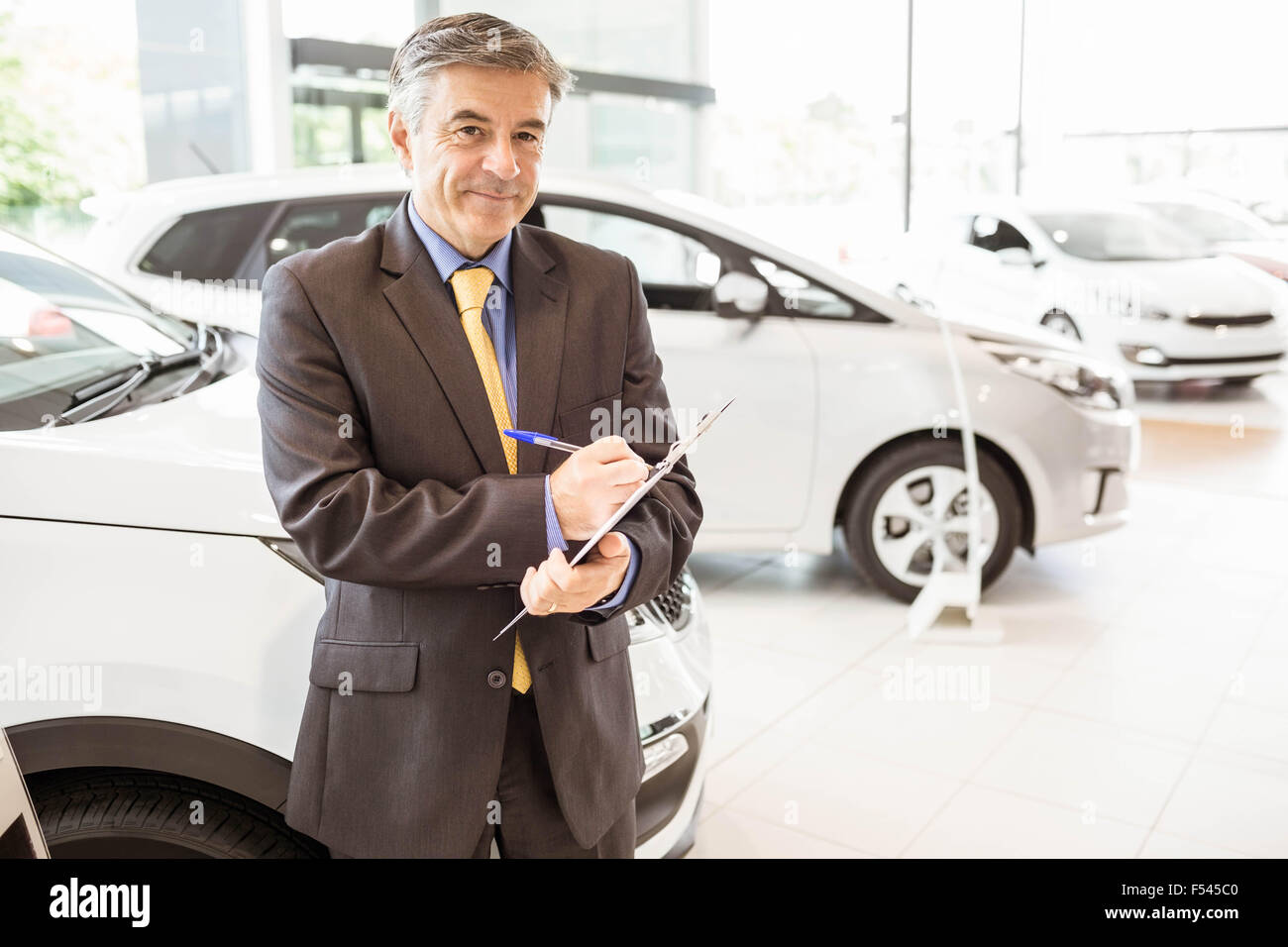 Portrait of a salesman with clipboard Stock Photo - Alamy