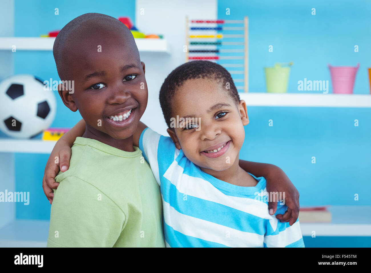 Happy kids playing games together Stock Photo - Alamy