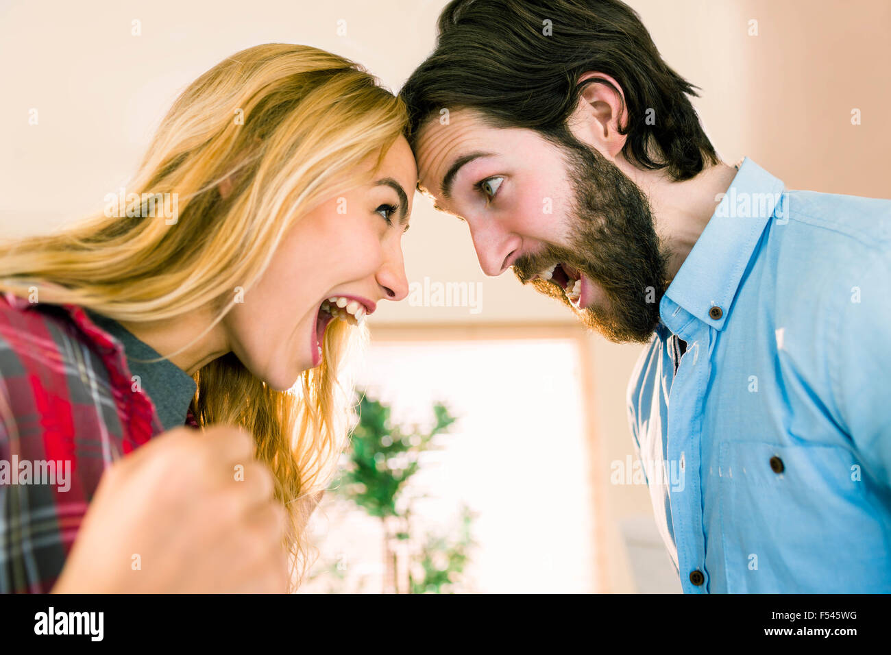 Creative team shouting at each other Stock Photo - Alamy