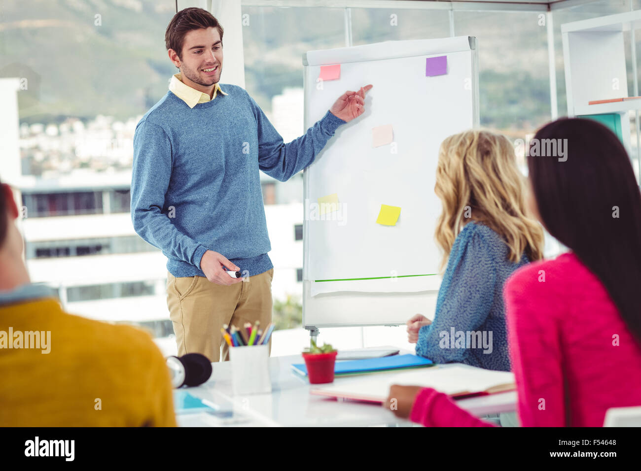 Creative businessman giving a presentation Stock Photo - Alamy