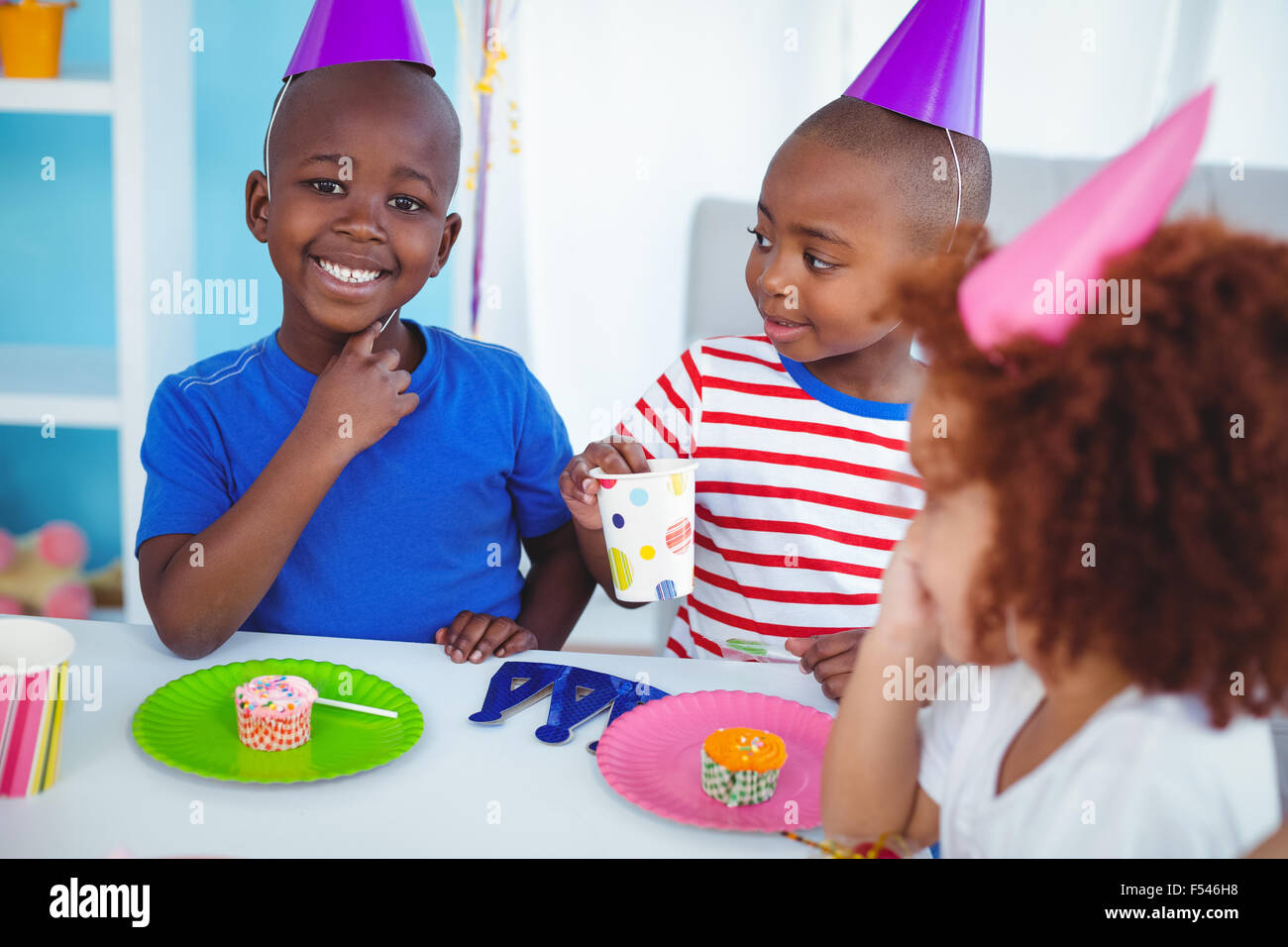 Excited kids enjoying a birthday party Stock Photo - Alamy