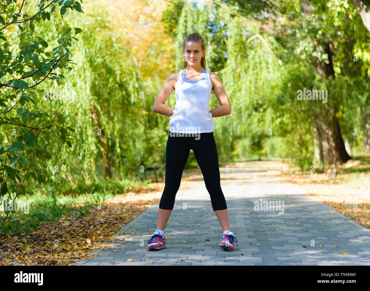 Attractive Woman stretching outdoor Stock Photo - Alamy