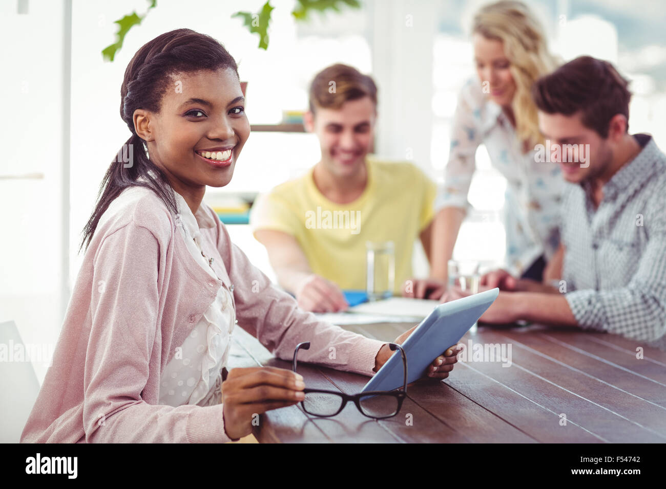 Creative business team working hard together Stock Photo - Alamy