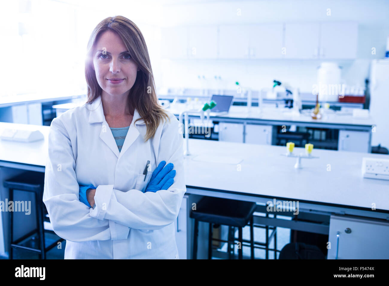 Scientist smiling at the camera in lab Stock Photo - Alamy
