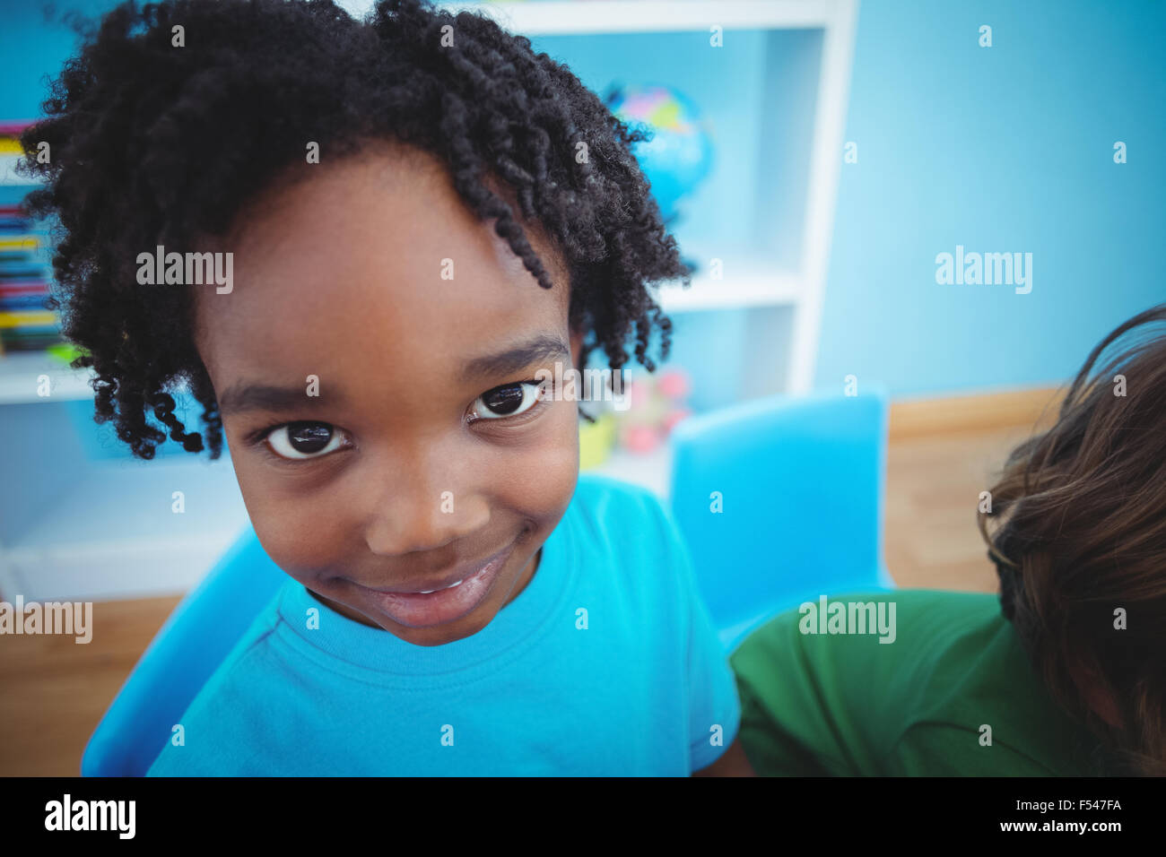 Smiling boy looking at the camera Stock Photo - Alamy