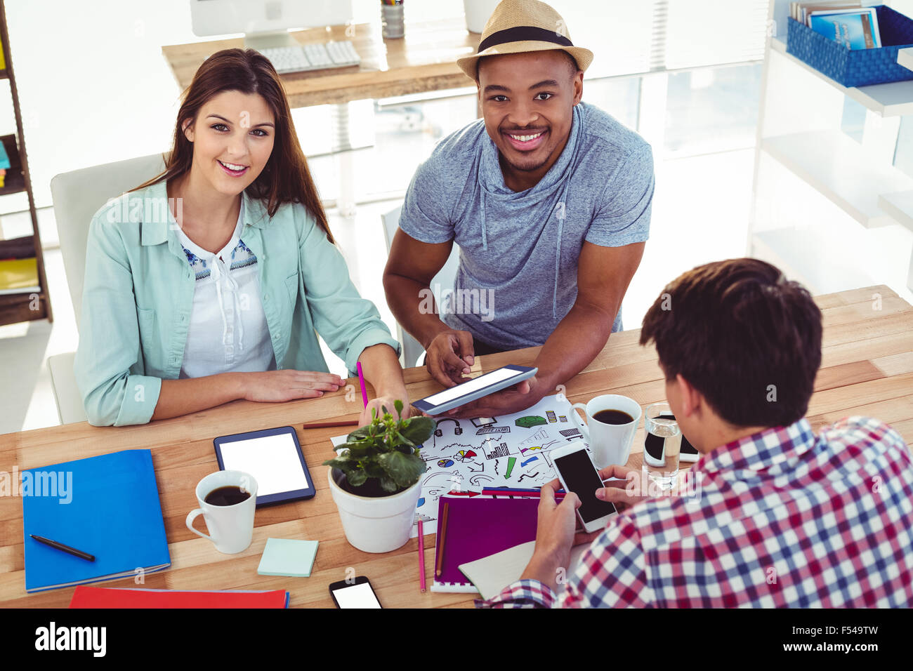 Young creative team working together Stock Photo - Alamy