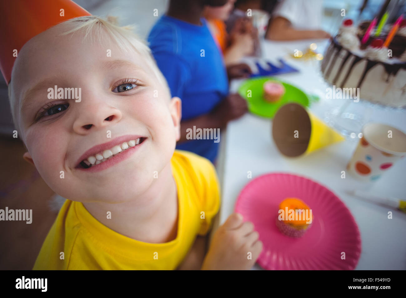 Excited kid enjoying a birthday party Stock Photo - Alamy