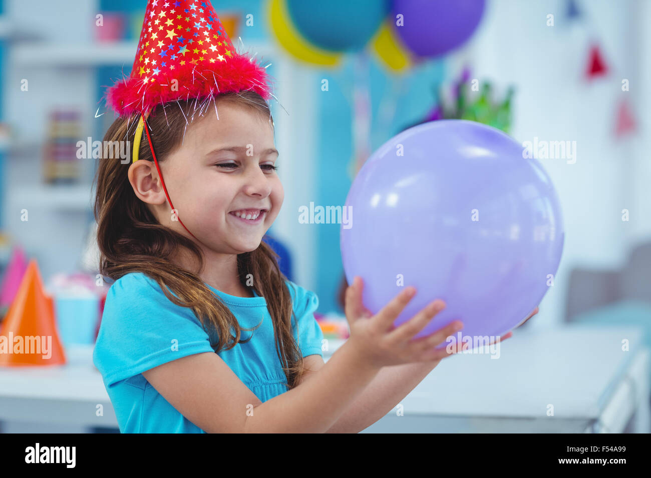 Kid holding balloon hi-res stock photography and images - Alamy
