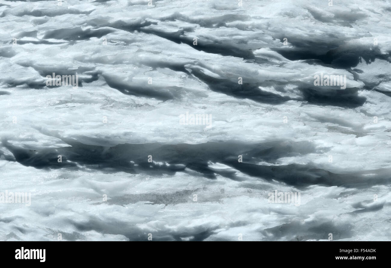 Wind form ice texture on winter mountain snow surface Stock Photo - Alamy