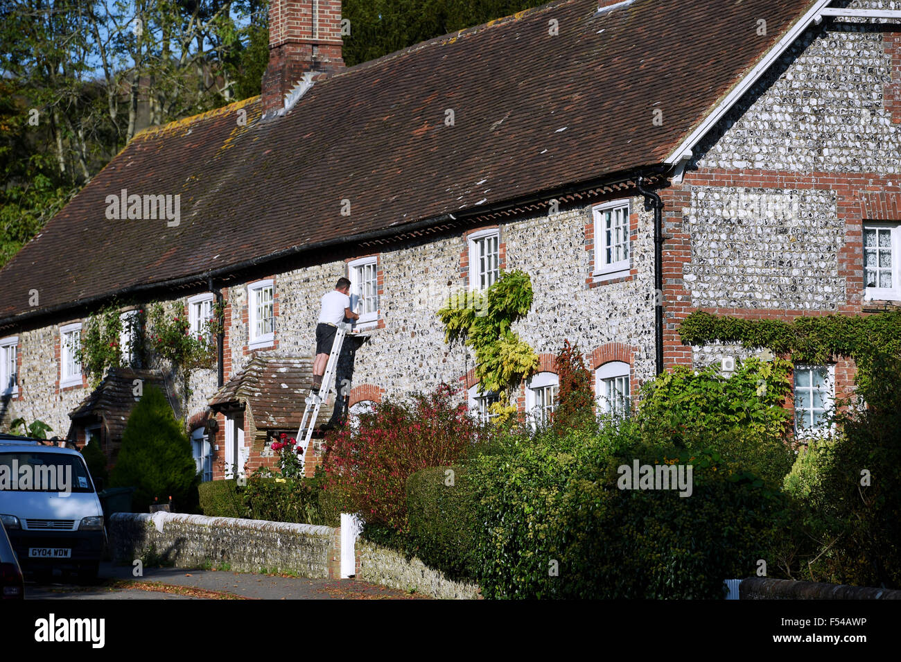 Old man up ladder hi-res stock photography and images - Alamy