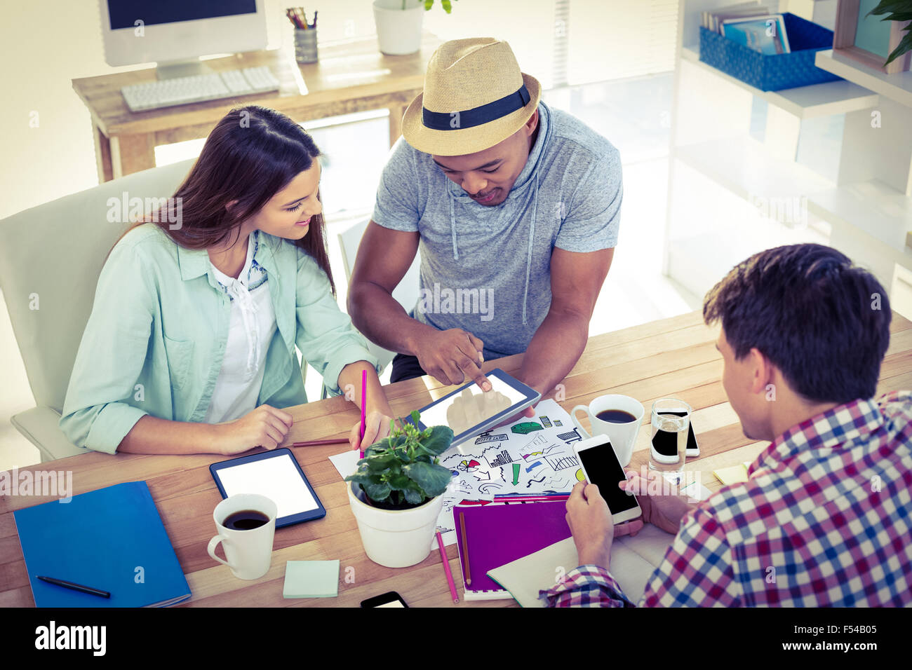 Young creative team working together Stock Photo - Alamy