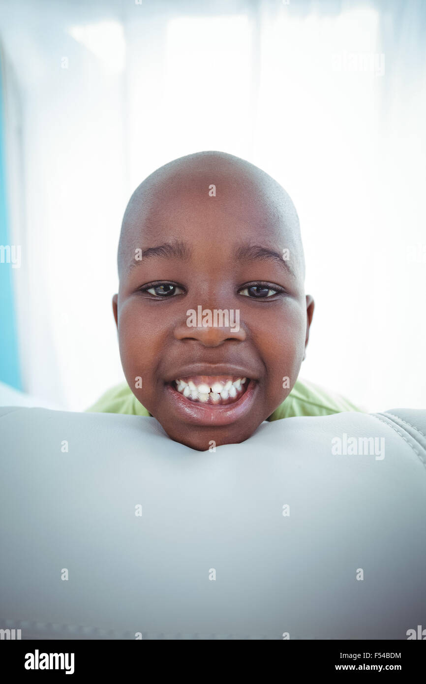 Happy kid looking from the back of the couch Stock Photo - Alamy