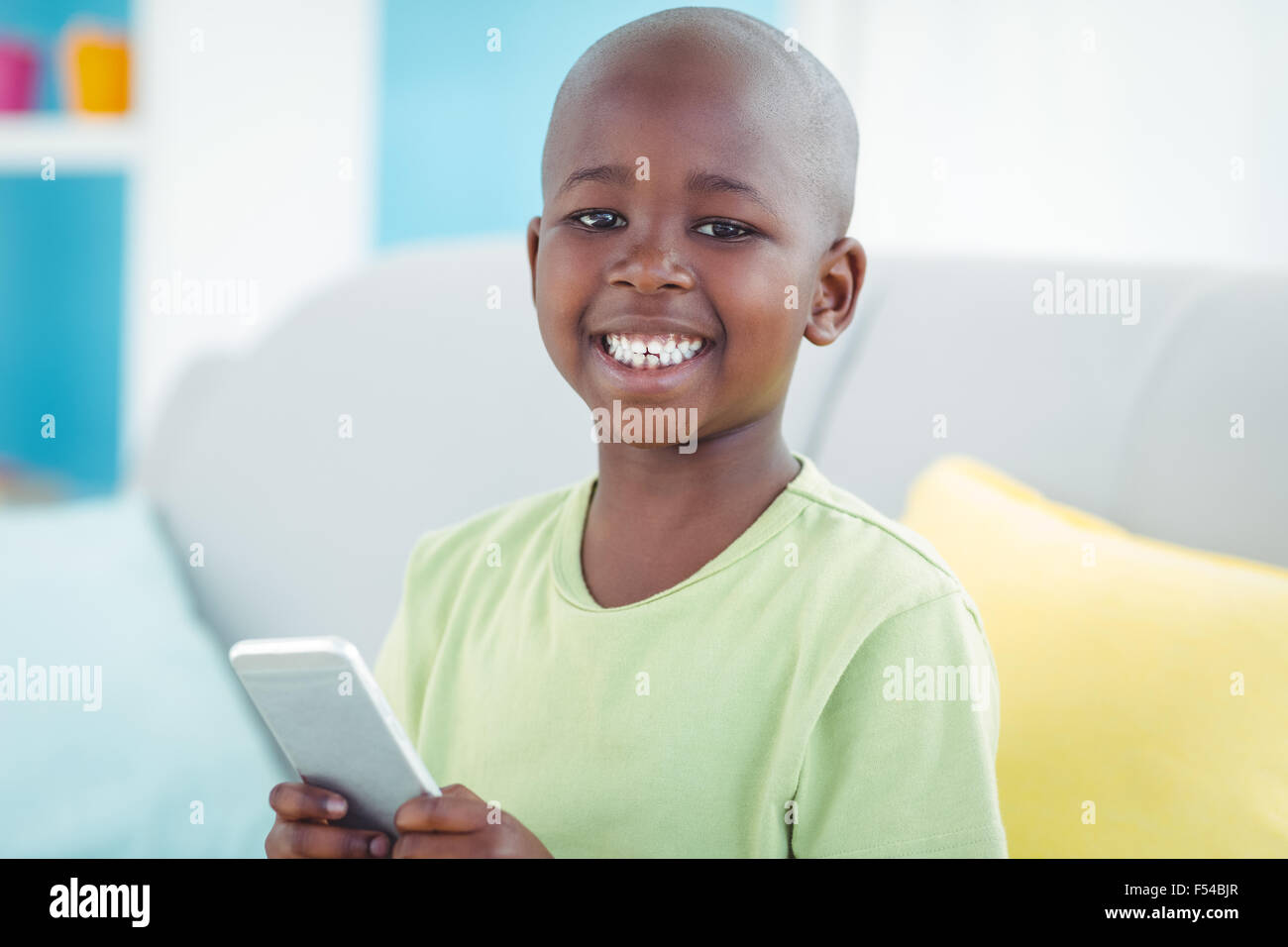 Happy boy using a smartphone Stock Photo - Alamy