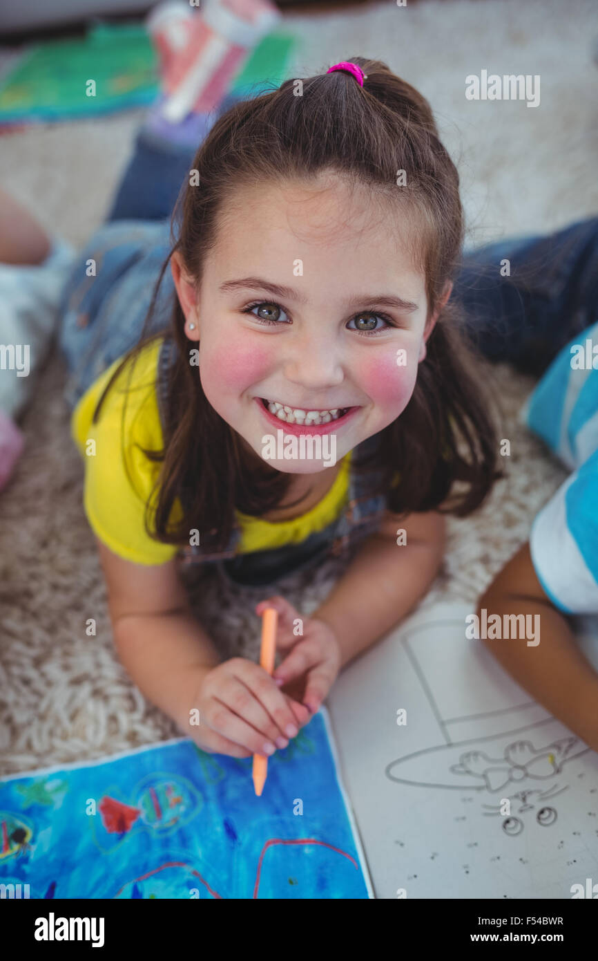 Smiling kids drawing pictures on paper Stock Photo - Alamy