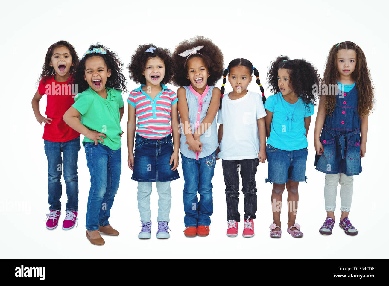 Smiling girl all standing in a row Stock Photo - Alamy
