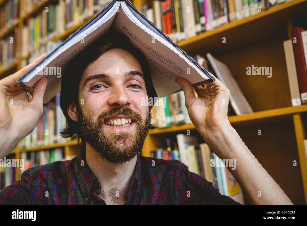 Student messing in the library Stock Photo - Alamy