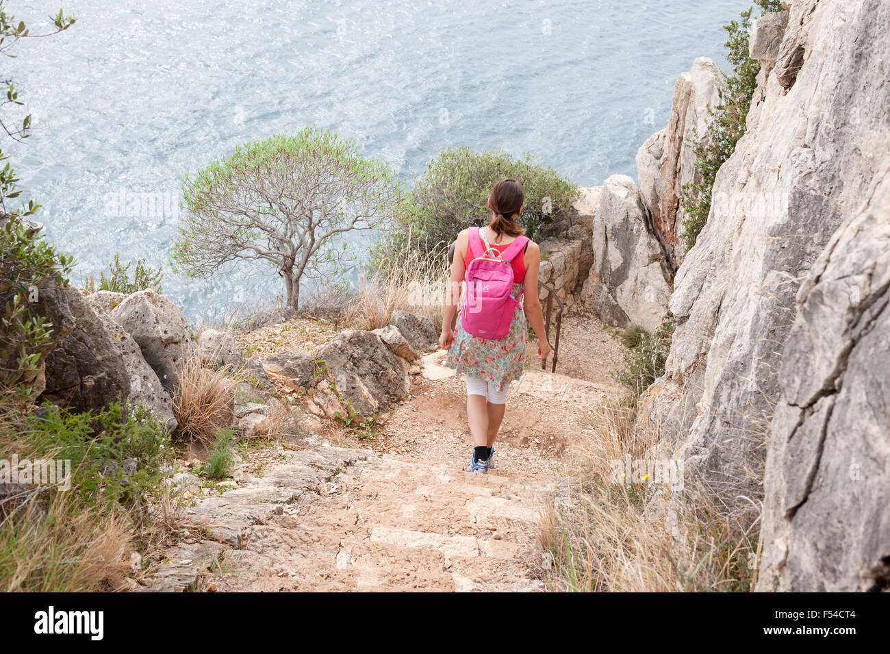 Person walking on a coastal path (sentier littoral) from Nice towards ...