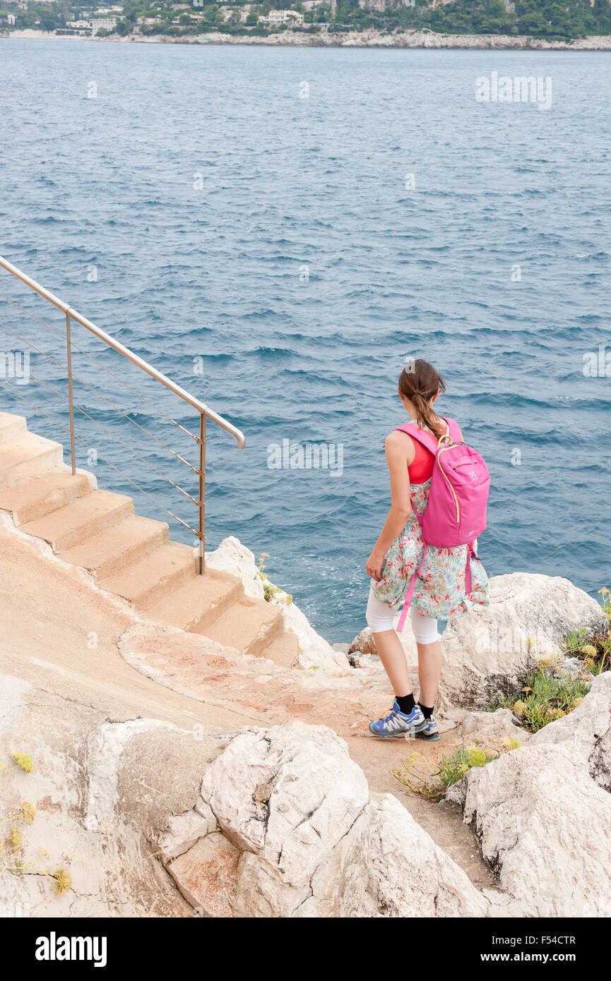 Person walking on a coastal path (sentier littoral) from Nice towards ...