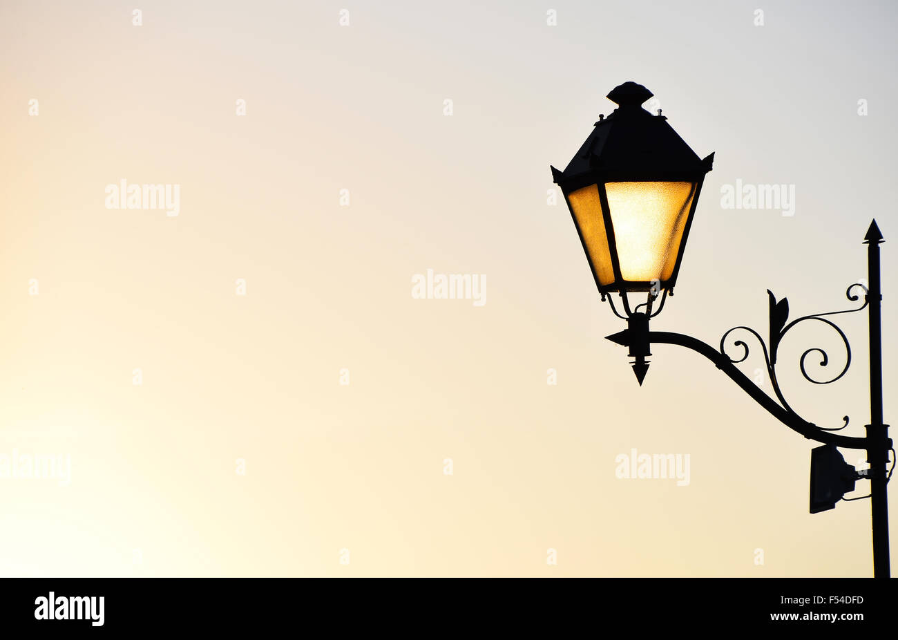 Street antique style lamp post with effect of shine from low light of ...