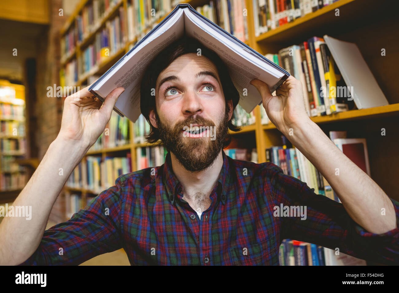 Student messing in the library Stock Photo - Alamy
