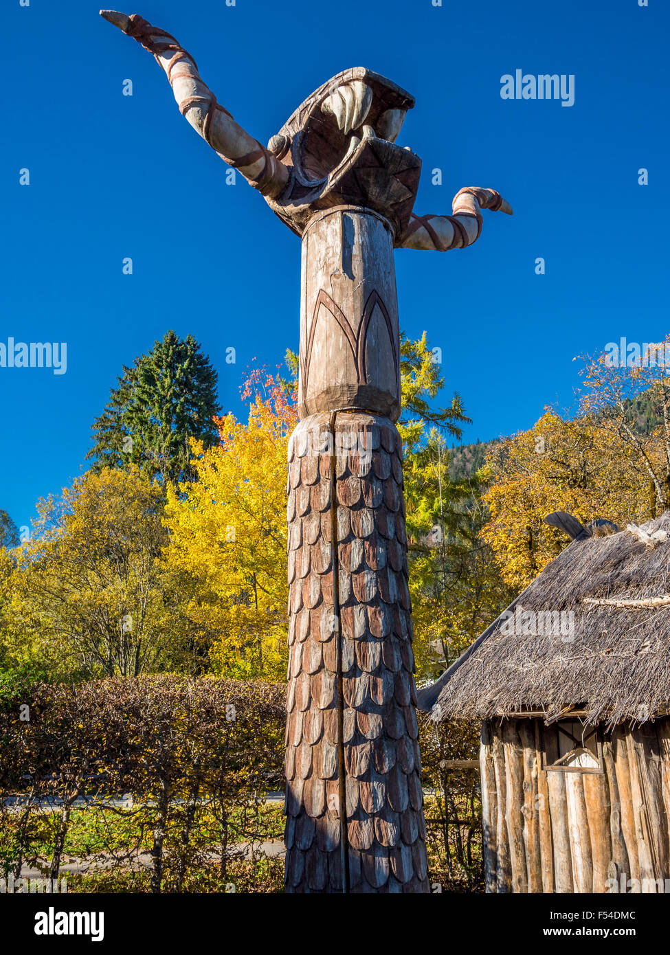 Horns, ornate wooden pole in the Flake Viking village, lake Walchensee ...