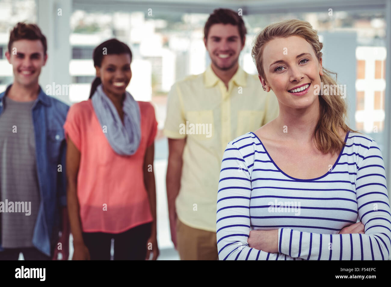 Happy creative team standing together Stock Photo - Alamy