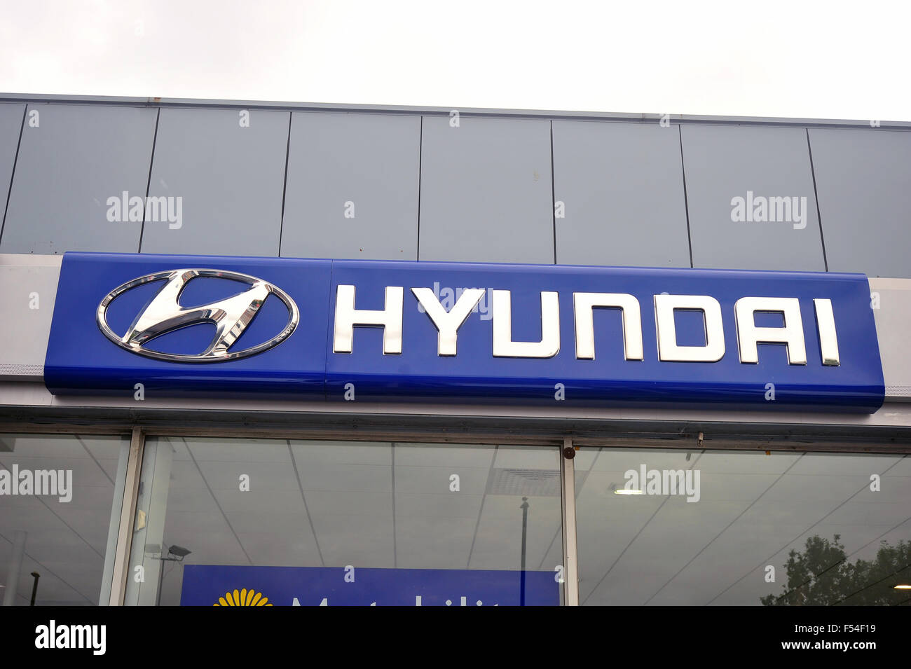 A Hyundai sign above the entrance to a Hyundai car dealership in the UK ...