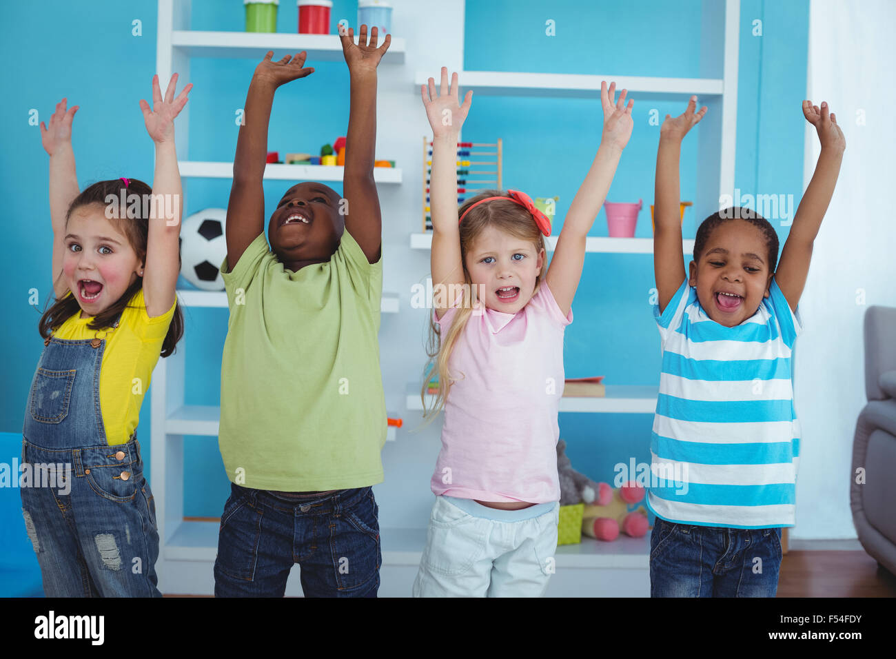 Kids arms raised hi-res stock photography and images - Alamy