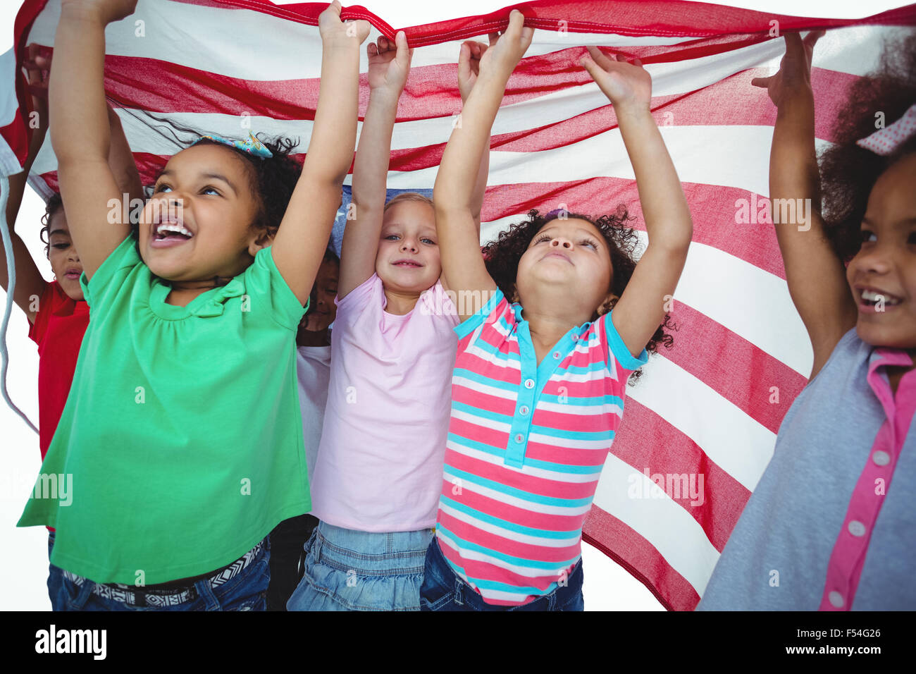 Girls standing with american flag overhead Stock Photo - Alamy