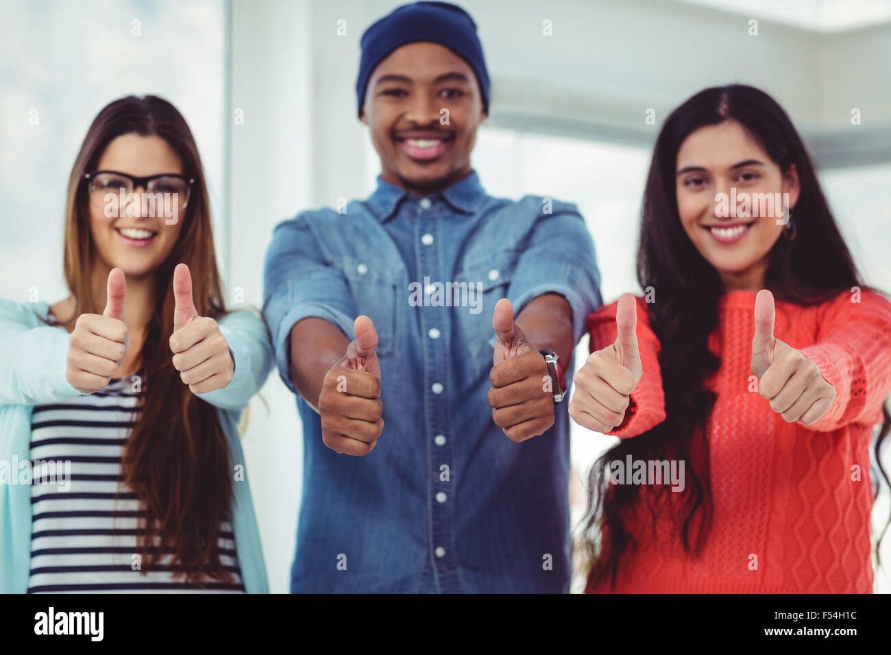 Thumbs up creative young woman hi-res stock photography and images - Alamy