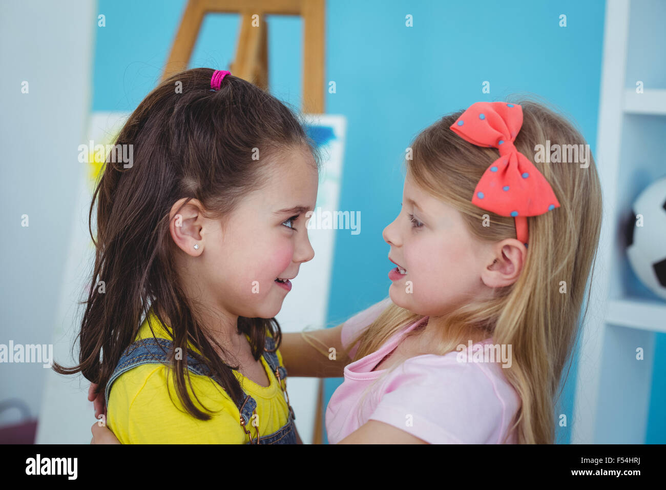 Happy girls hugging each other Stock Photo - Alamy