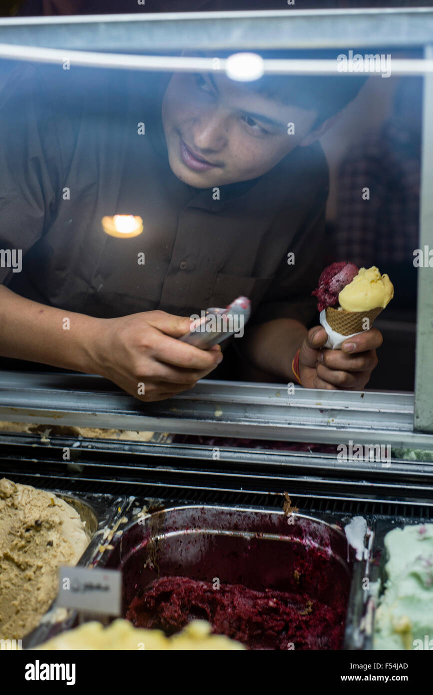Vendor put ice cream bolls into cone, Tehran, Iran Stock Photo - Alamy