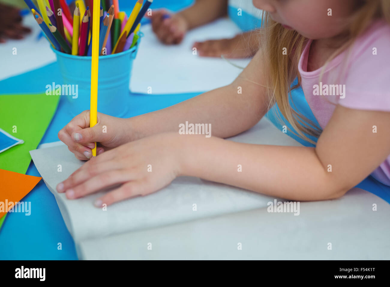Happy kids enjoying arts and crafts together Stock Photo - Alamy