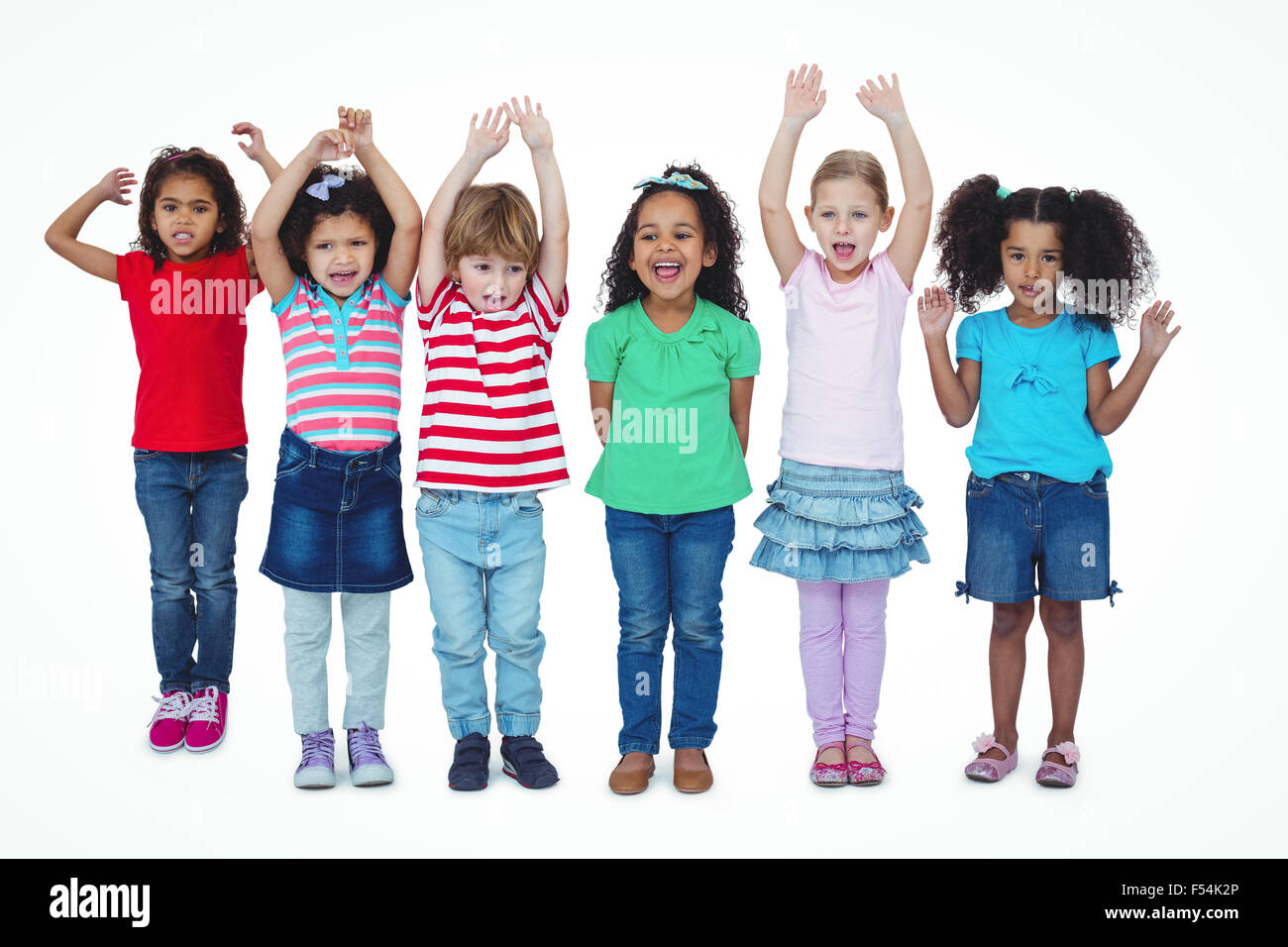 Small group of kids standing together with arms raised Stock Photo - Alamy