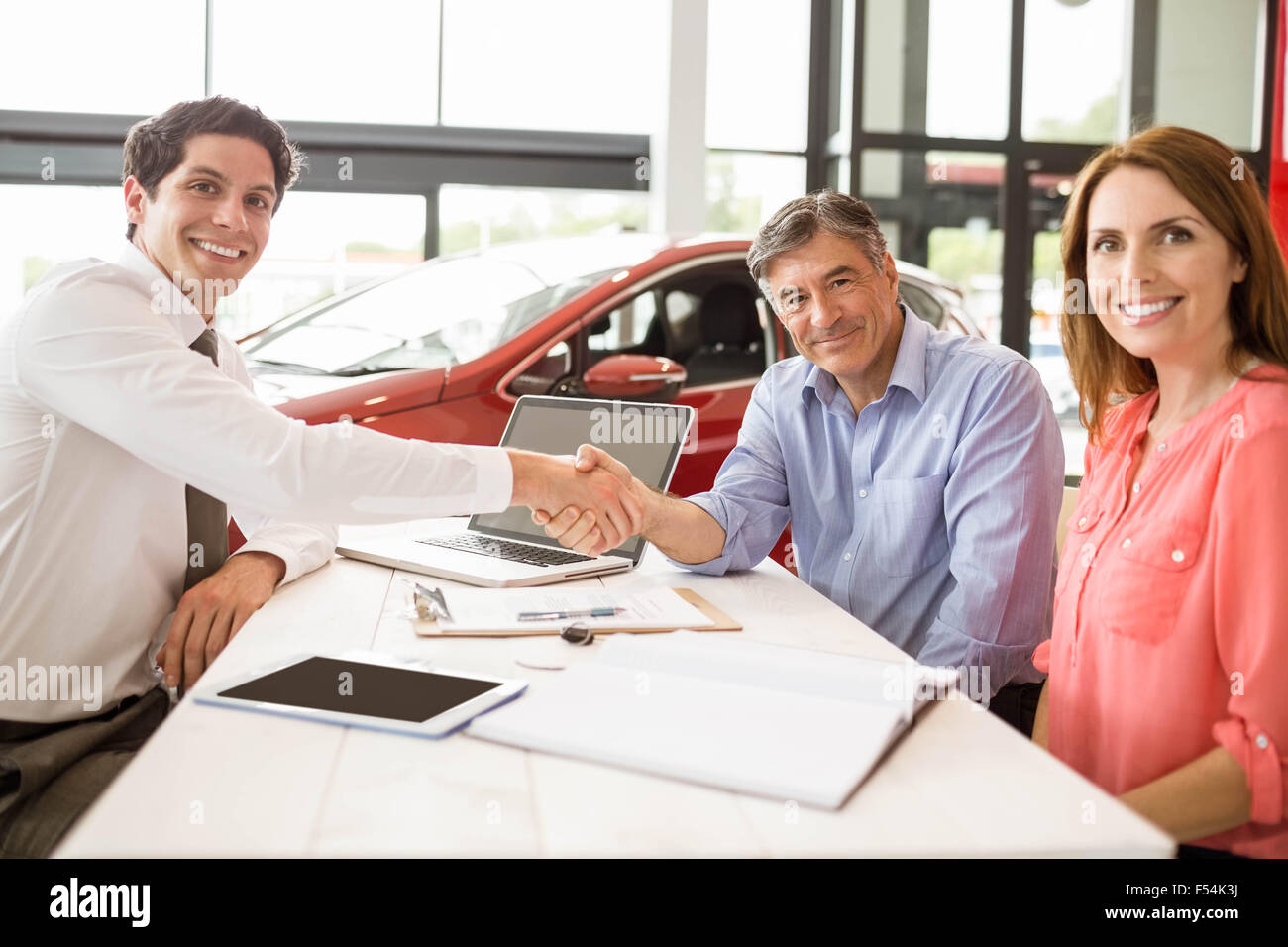 Customers signing some important documents Stock Photo - Alamy