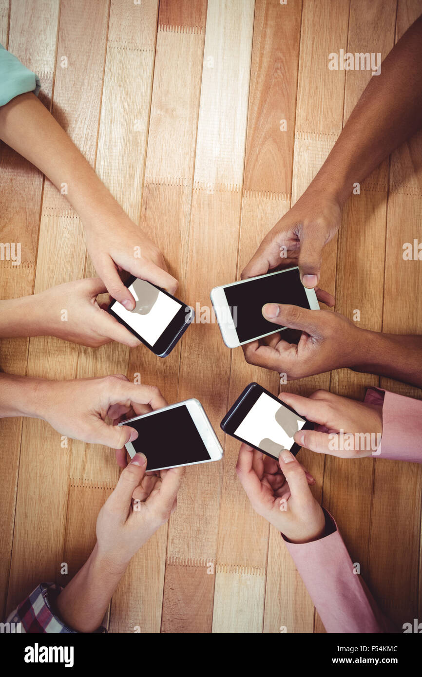 Young creative team using phones Stock Photo - Alamy