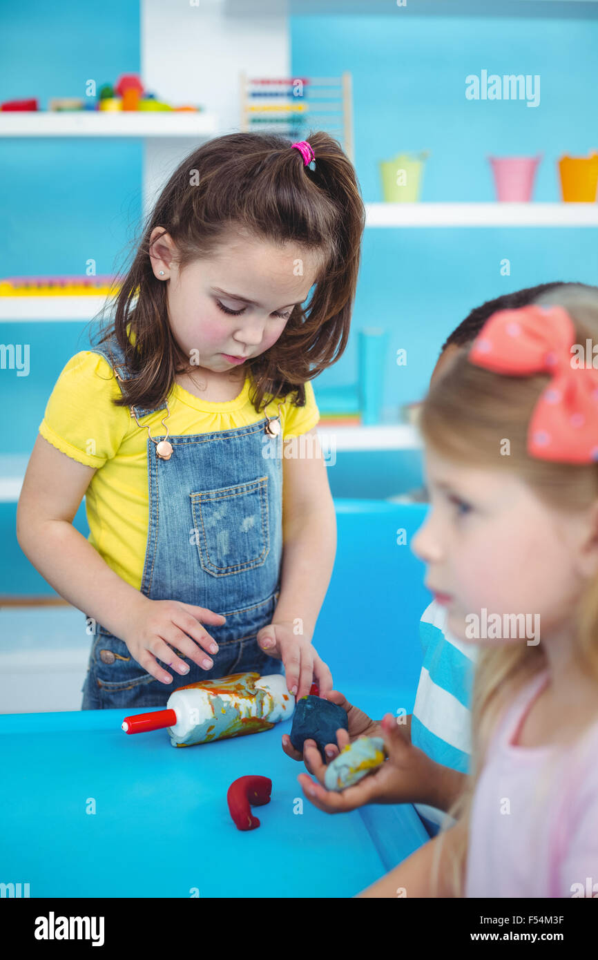 Happy kids enjoying arts and crafts together Stock Photo - Alamy